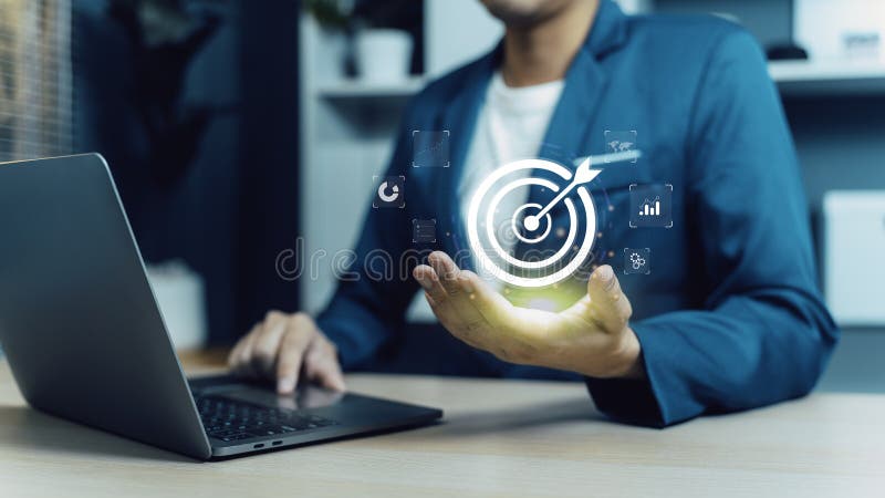 A Man is Holding a Laptop with a Target on it. Concept of Focus and ...