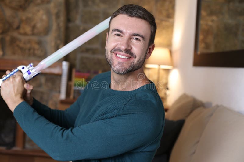 Man holding a laser sword stock photo. Image of fantastic - 247656110