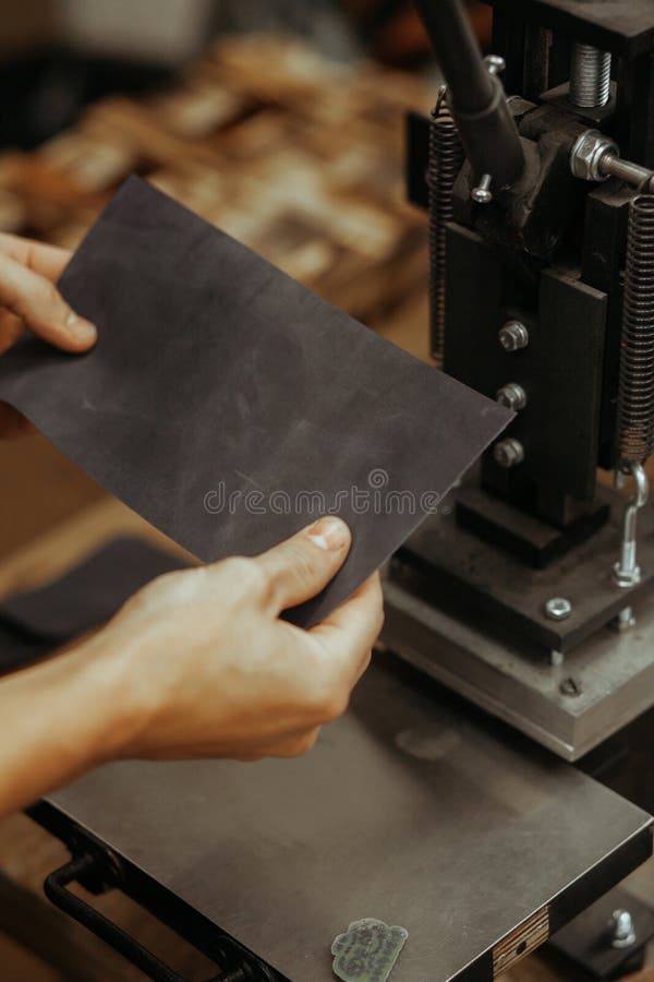 Man Holding Leather Craft and Working. Press Machine in the Workshop ...