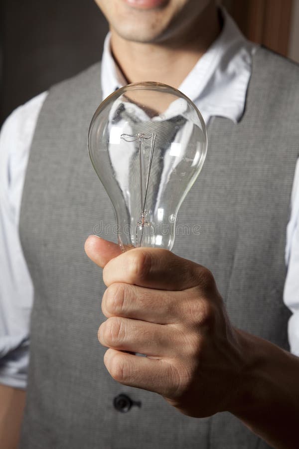Man holding light bulb stock image. Image of fuel, idea - 19971089