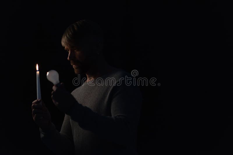 Man Holding Light Bulb and Burning Stock Photo - Image of night ...