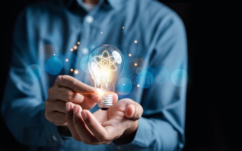 Man Holding Light Bulb with Learning Education and Graduation Concept ...