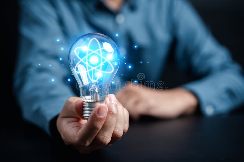 Man Holding Light Bulb with Learning Education and Graduation Concept ...