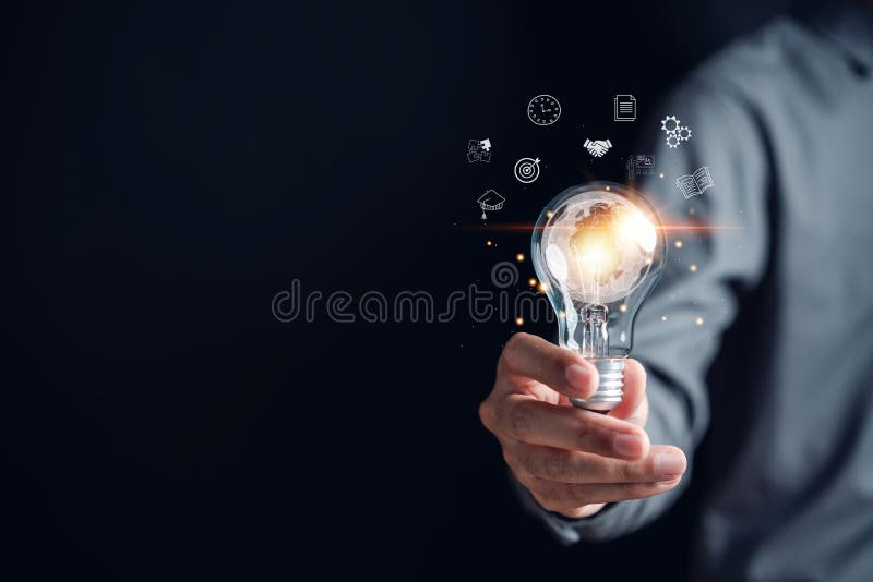 Man Holding Lightbulb with Learning Educate and Graduation Concept ...