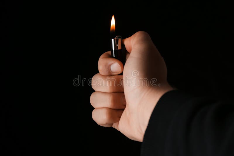 Man Holding Lighter on Black Background, Closeup Stock Image - Image of ...
