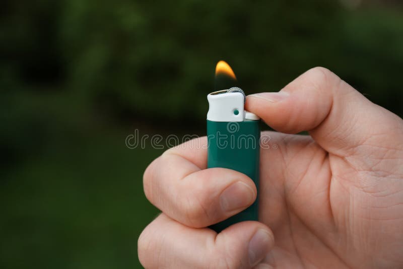 528 Man Holding Lighter Stock Photos - Free & Royalty-Free Stock Photos ...