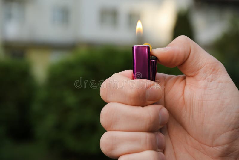 528 Man Holding Lighter Stock Photos - Free & Royalty-Free Stock Photos ...