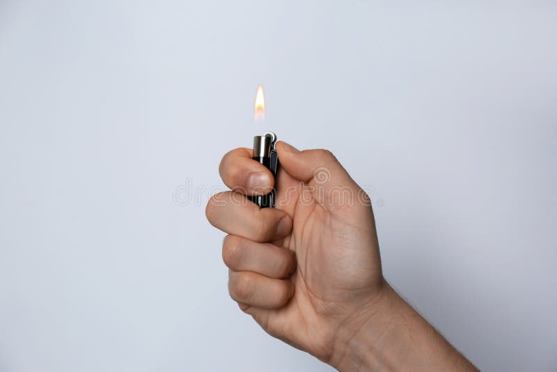 528 Man Holding Lighter Stock Photos - Free & Royalty-Free Stock Photos ...