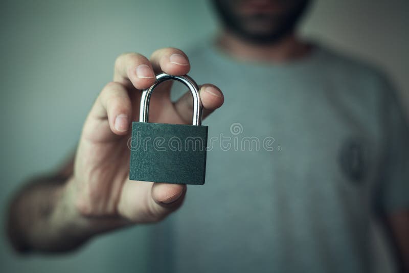 Man holding lock. stock photo. Image of sign, online - 112545884