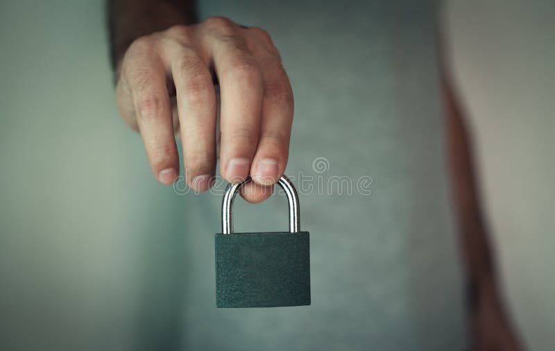 Man holding lock. stock photo. Image of sign, online - 112546016