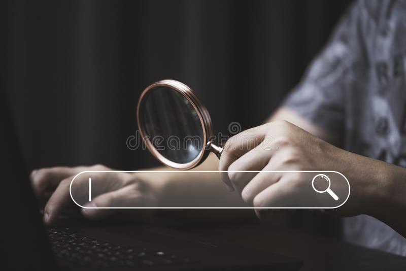 Man Holding Magnifier Glass and Using Computer Laptop with Search Bar ...