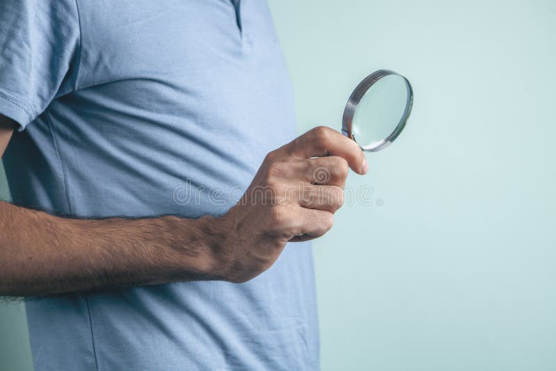Man Holding a Magnifying Glass in His Hands Search for Information ...