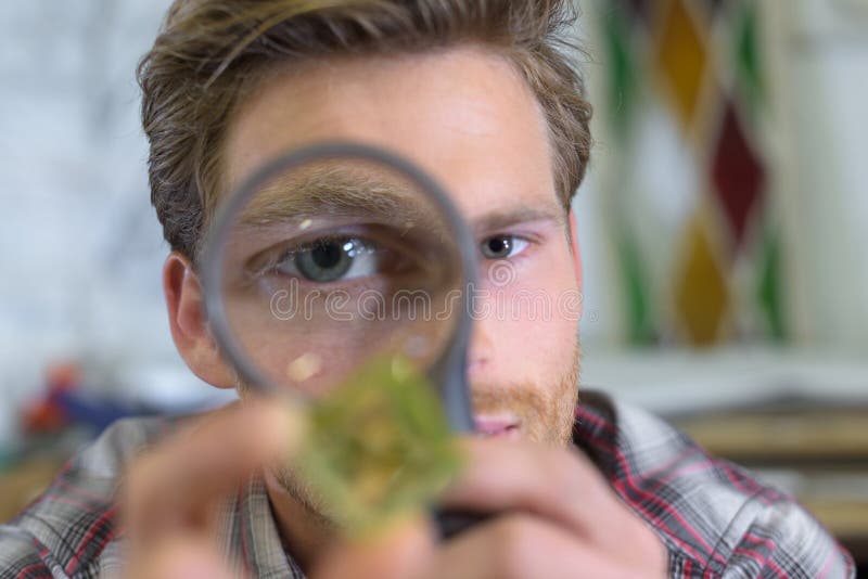 Man Holding Magnifying Glass and Magnifying Viewer Ring Stock Photo ...