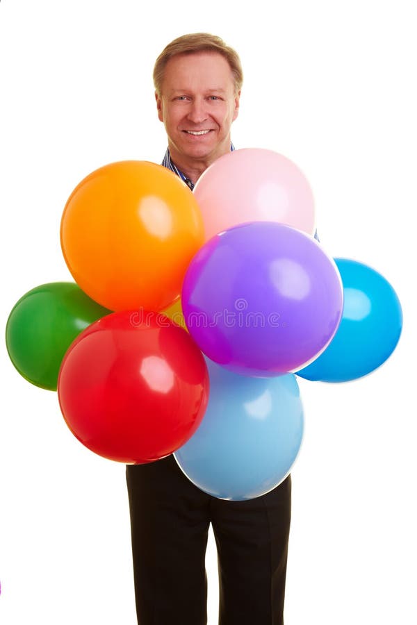 Man holding many balloons stock photo. Image of male - 15518608