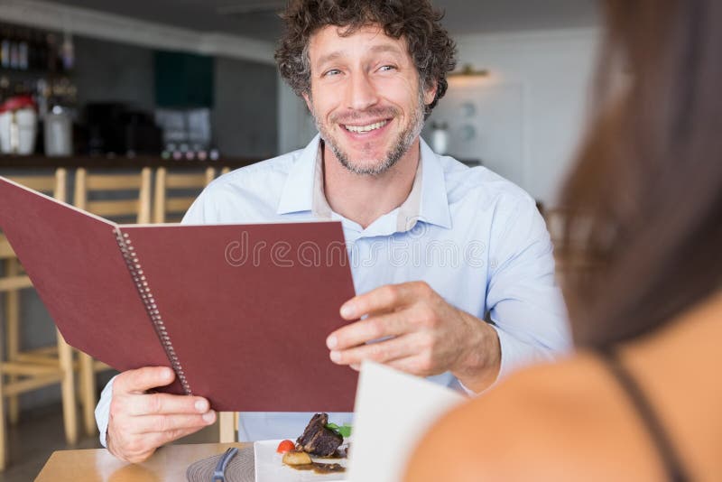 Man Holding Menu Card and Smiling Stock Image - Image of holding ...