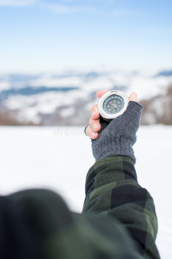 Man Holding a Metal Compass on Mountain Stock Photo - Image of east ...
