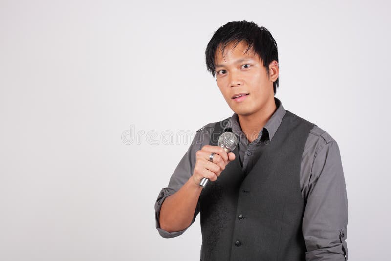 Man holding a microphone stock photo. Image of stylish - 22125028