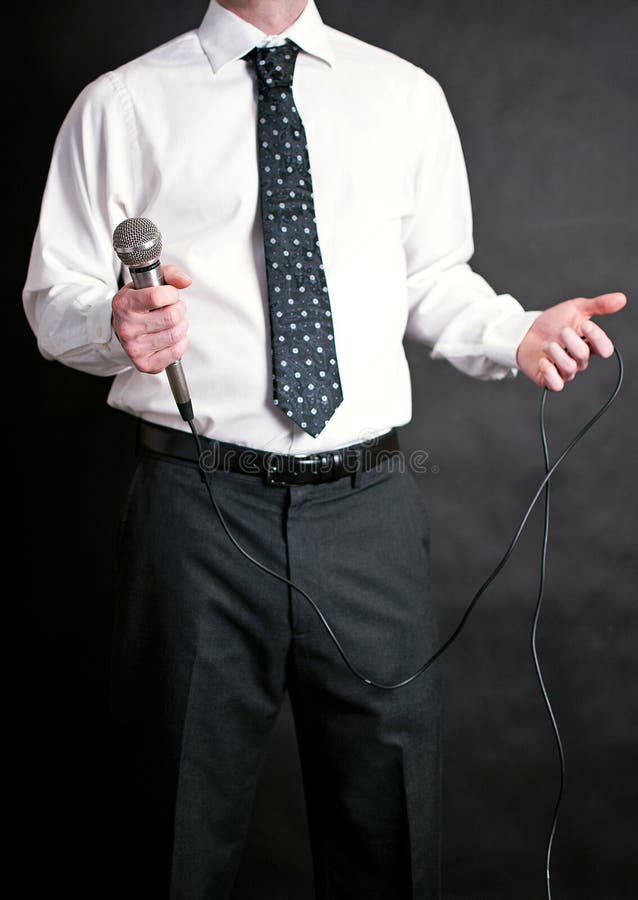 Man holding a microphone stock image. Image of speaker - 22837537