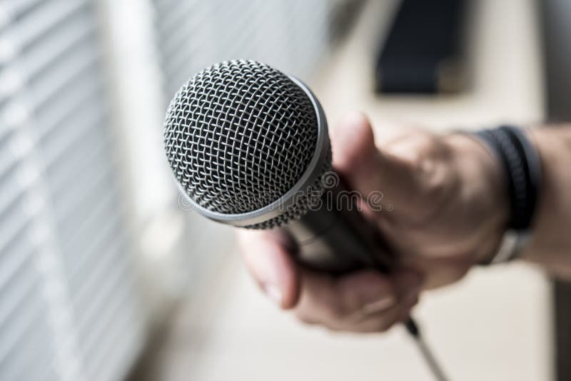 Man Holding Microphone On Stage Picture. Image: 115550388