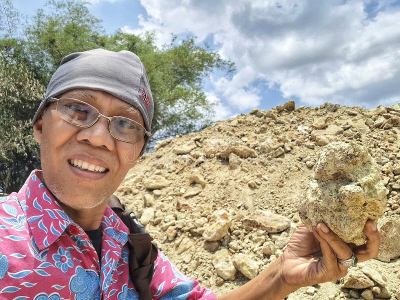 A Man Holding a Mining Stone in Mining Field Stock Photo - Image of ...