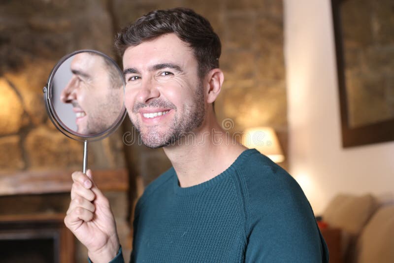Man Holding Mirror with His Profile Reflection Stock Image - Image of ...