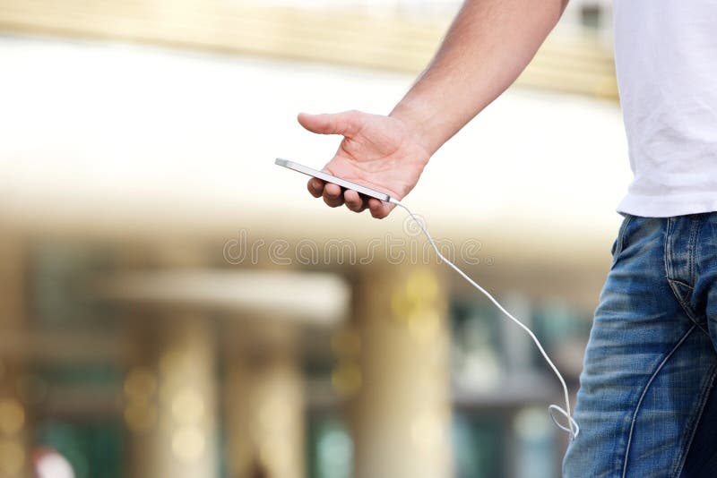 Man Holding Mobile Phone with Charging Wire Attached Stock Image ...