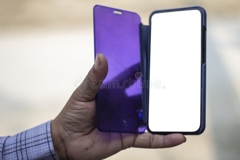 A Man is Holding a Mobile Phone in His Hand and the Mobile Screen ...