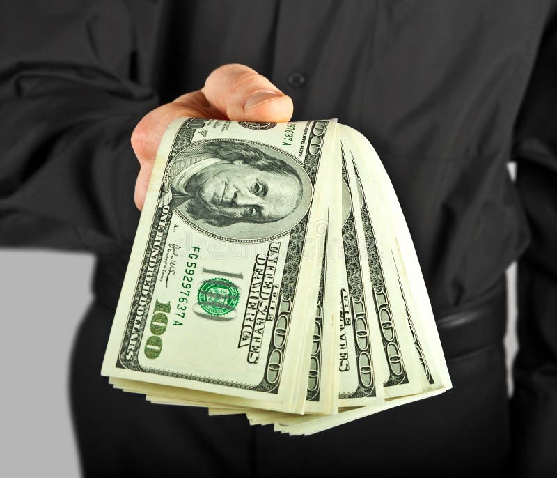 Man holding money in hands stock image. Image of person - 51681365
