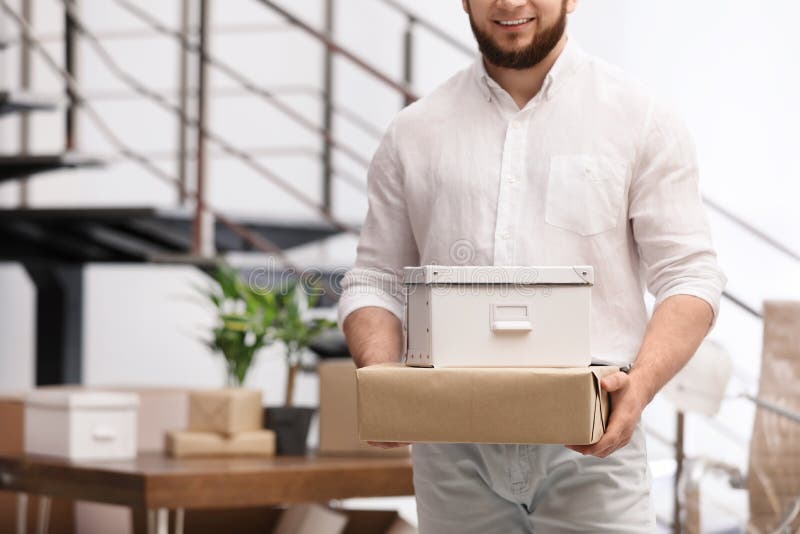 Man Holding Moving Boxes in New Office, Closeup Stock Photo - Image of ...