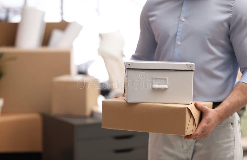 Man Holding Moving Boxes in New Office. Space for Text Stock Photo ...