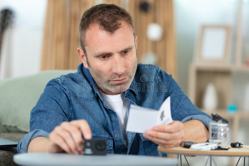 Man Holding New Camera Reading Instruction Stock Photo - Image of ...