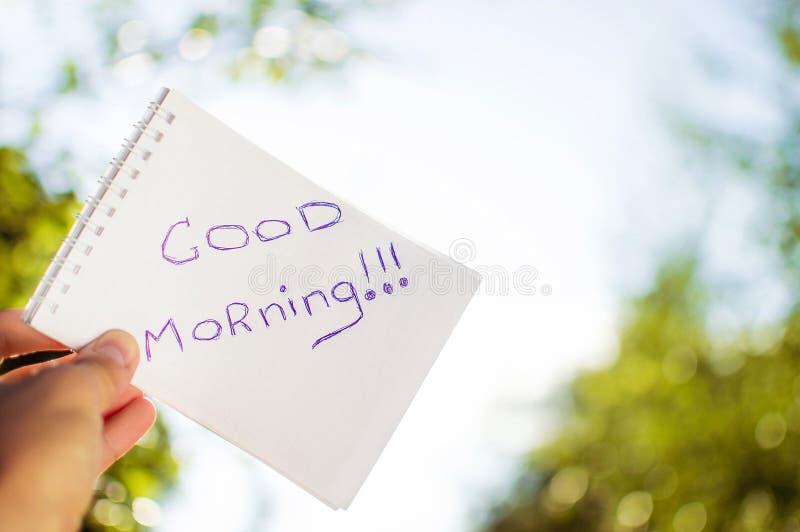 Man Holding a Notebook that Says Good Morning. Stock Photo - Image of ...