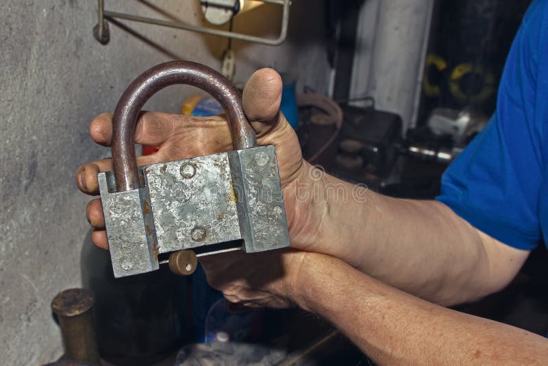 Man Holding Old Rusty a Lock in His Hands. Stock Photo - Image of ...