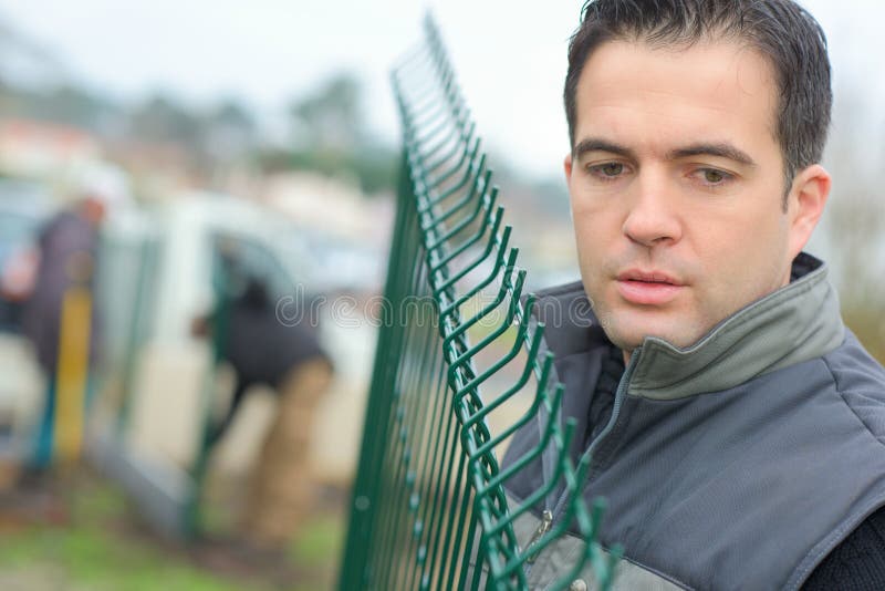 Man Holding Outdoor Fencing Stock Image - Image of team, blurred: 232509627
