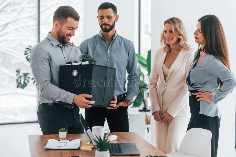 Man Holding Package. Group of Business People that Working on the ...