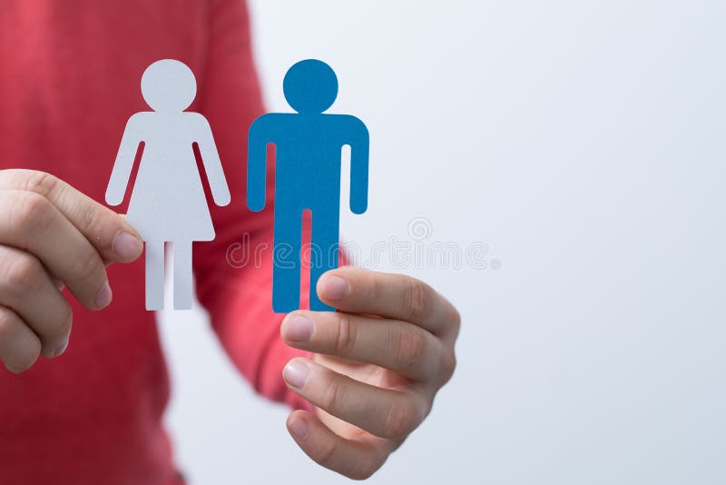 Man Holding the Paper Cutouts of Human Figures Stock Photo - Image of ...