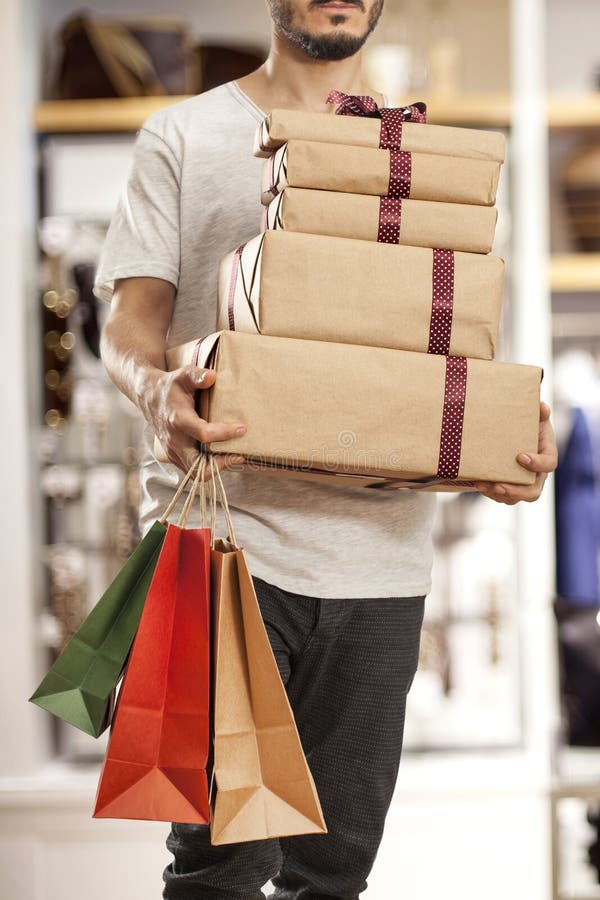 Man Holding Paper Shopping Bag with Gift Boxes Stock Image - Image of ...