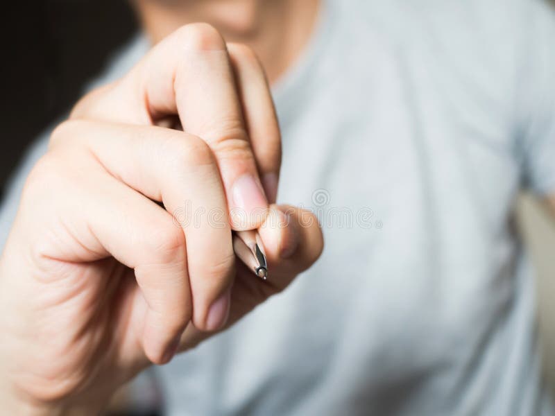 Man Holding Pen, Writing and Drawing in the Air with Copy Space Stock ...