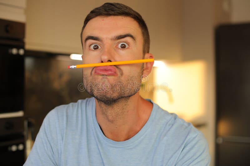 Man Holding a Pencil between His Lips and His Nose Stock Image - Image ...