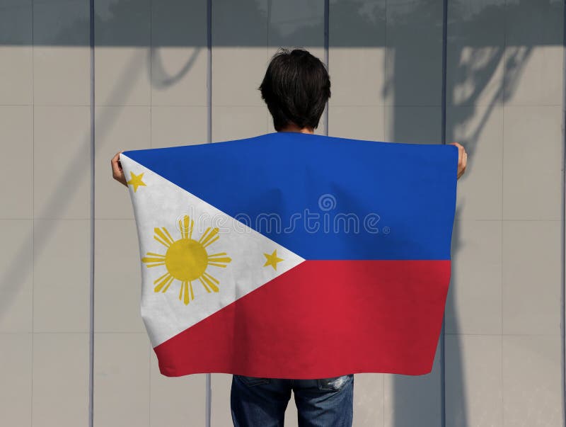 The Man Holding Philippines Flag on His Shoulder and Turn Back on Grey ...