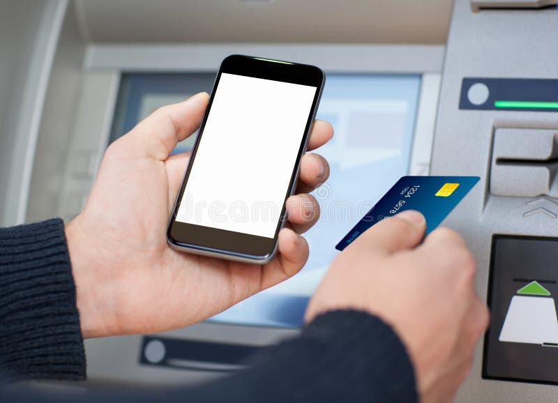 Man Holding Phone and a Credit Card at an ATM Stock Image - Image of ...