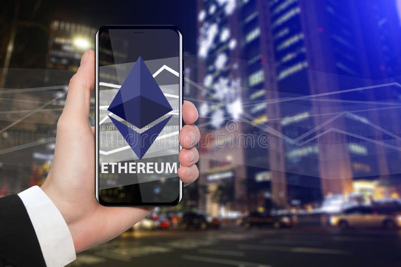 Man Holding a Phone with a Ethereum Symbol Editorial Photo - Image of ...
