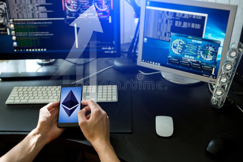 Man Holding a Phone with a Ethereum Symbol Editorial Photography ...
