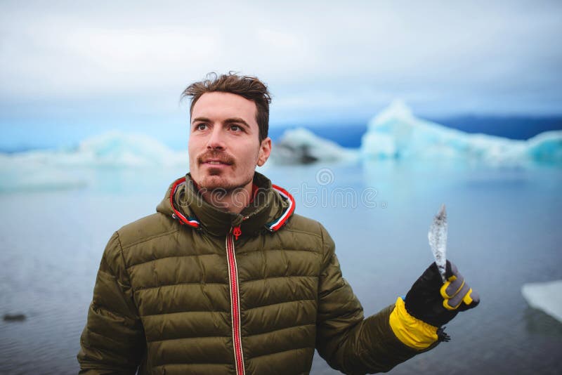 Man Holding Piece of Ice stock photo. Image of family - 83587106