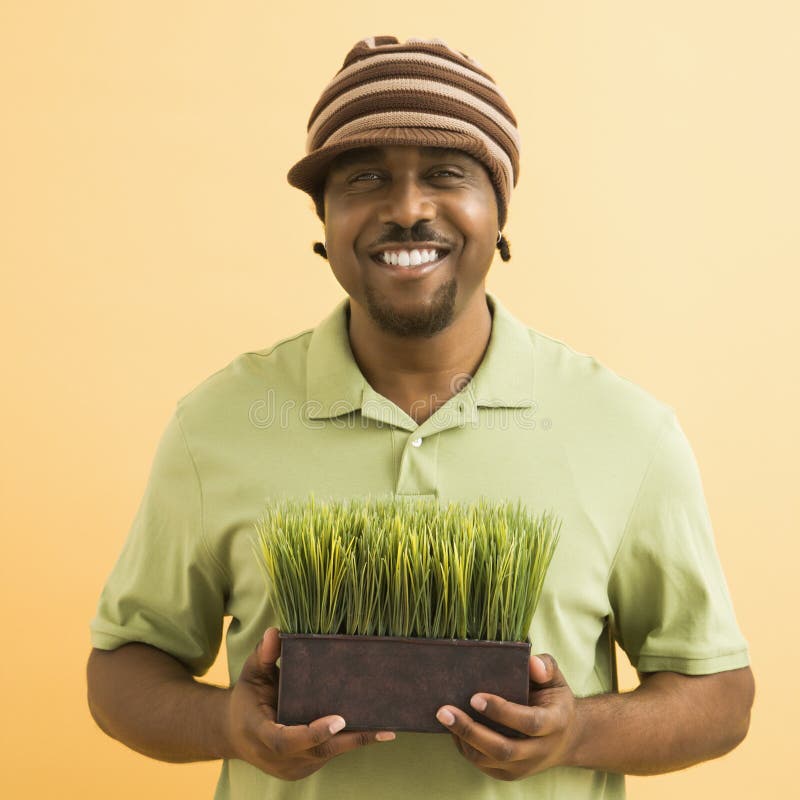 Man holding plant. stock photo. Image of grass, color - 4489318