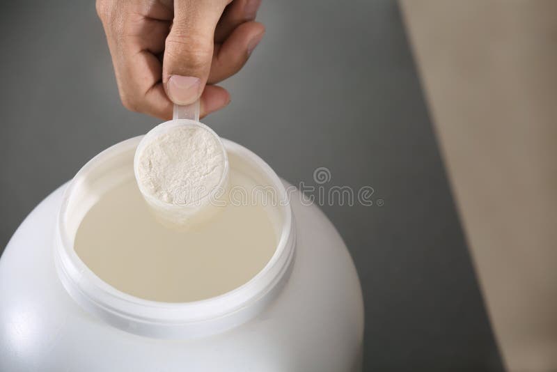 Man Holding Plastic Scoop with Protein Powder Stock Image - Image of ...