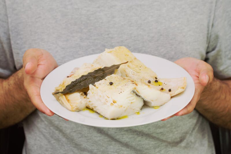 Man Holding Plate with Boiled Fish Stock Photo - Image of holding, diet ...
