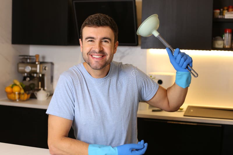 Man Holding a Plunger in His Kitchen Stock Photo - Image of household ...