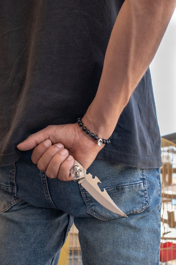 Man Holding Knife Behind Back Stock Photos - Free & Royalty-Free Stock ...