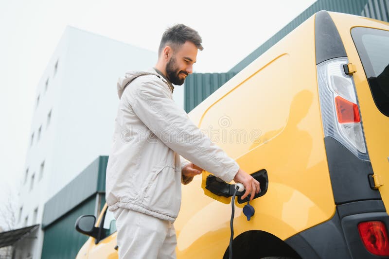 Man Holding Power Connector for Electric Car Stock Image - Image of ...